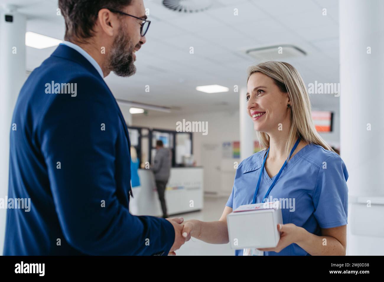 Doctor talking pharmaceutical sales rep hi-res stock photography and ...