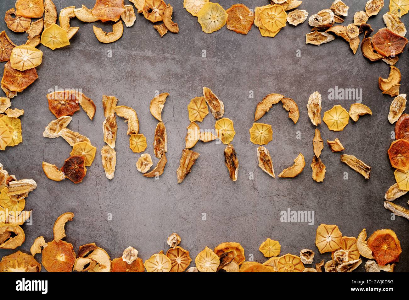 Word made of pieces of dried fruits on a dark cement background in a ...
