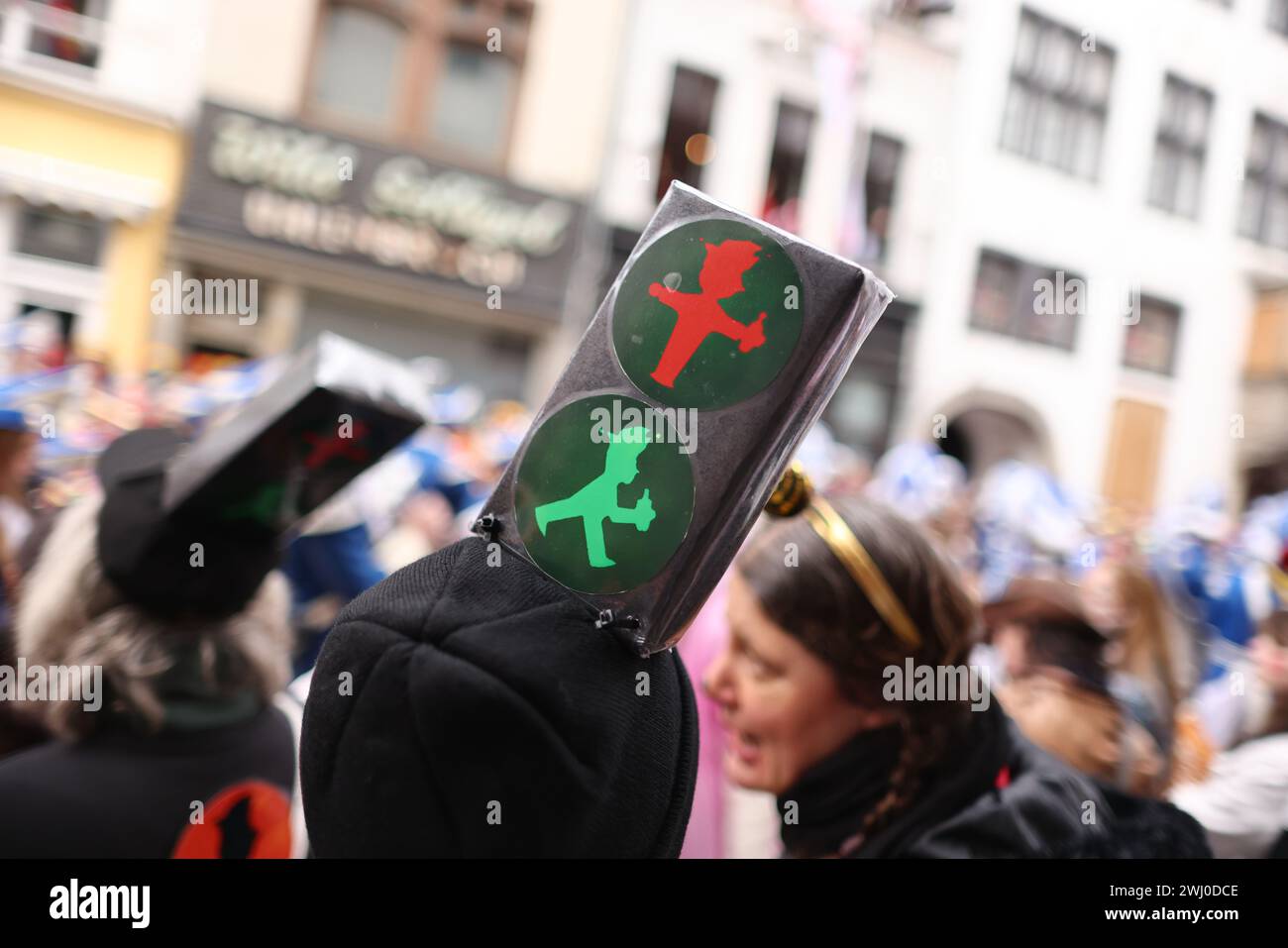 Cologne, Germany. 12th Feb, 2024. A Jecke with a traffic light cap ...