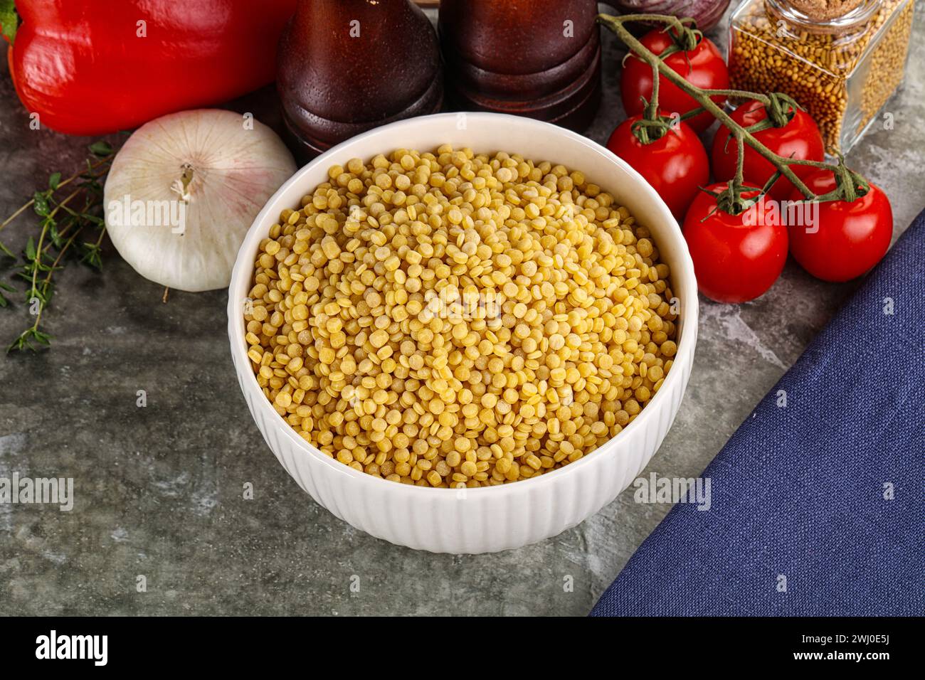 Dry ptitim heap in the bowl for cooking Stock Photo - Alamy