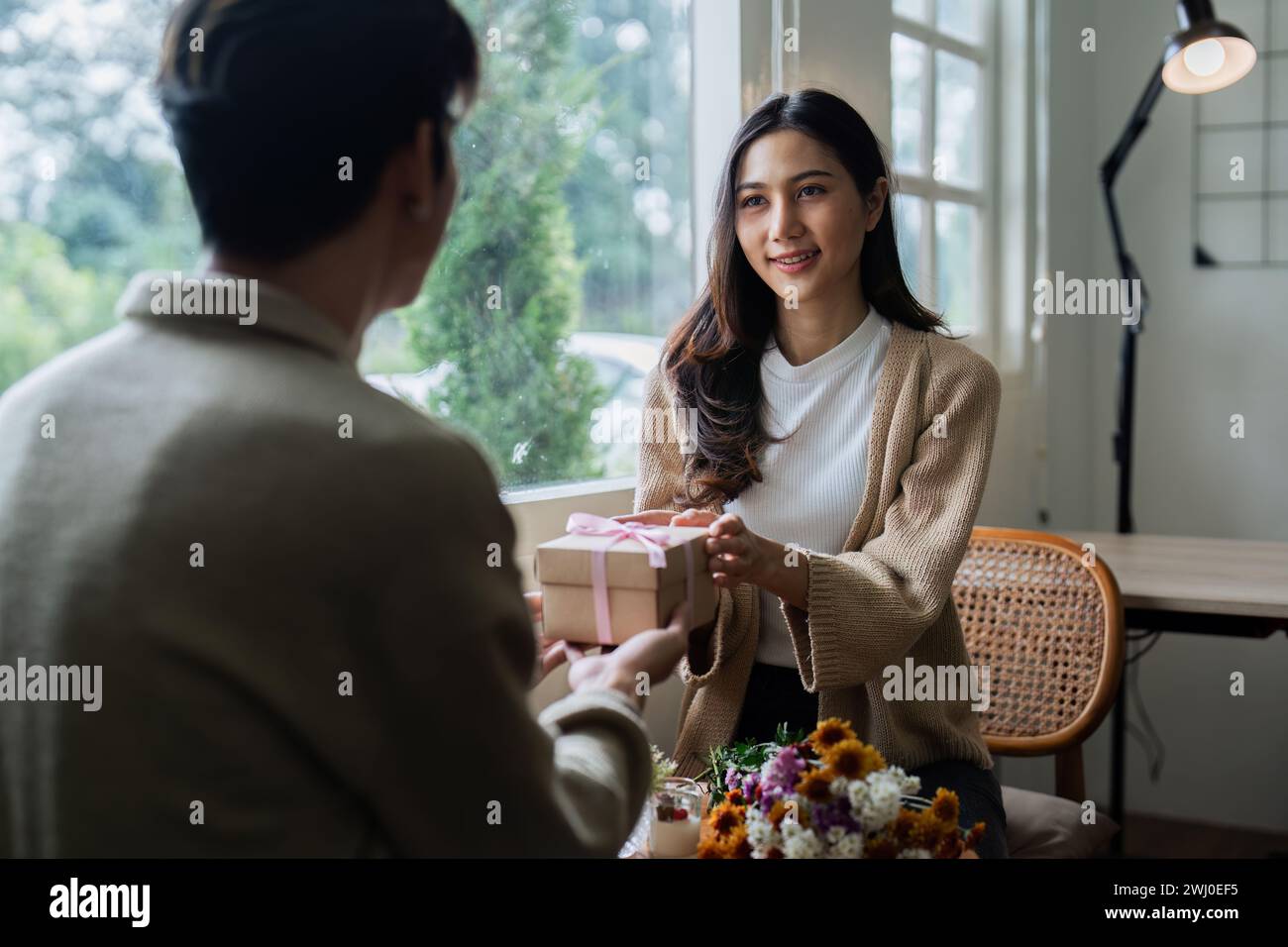 Young couple Hug and giving present on Valentine's Day. Romantic day ...