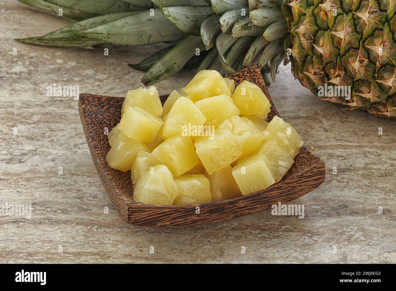 Marinated pineapple slices cubes in the bowl Stock Photo - Alamy