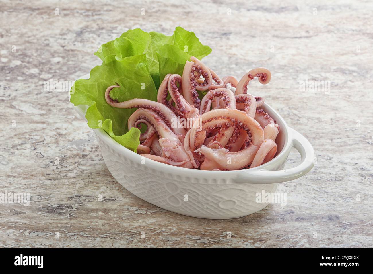 Marinated squid kalamri tentacles in the bowl Stock Photo - Alamy