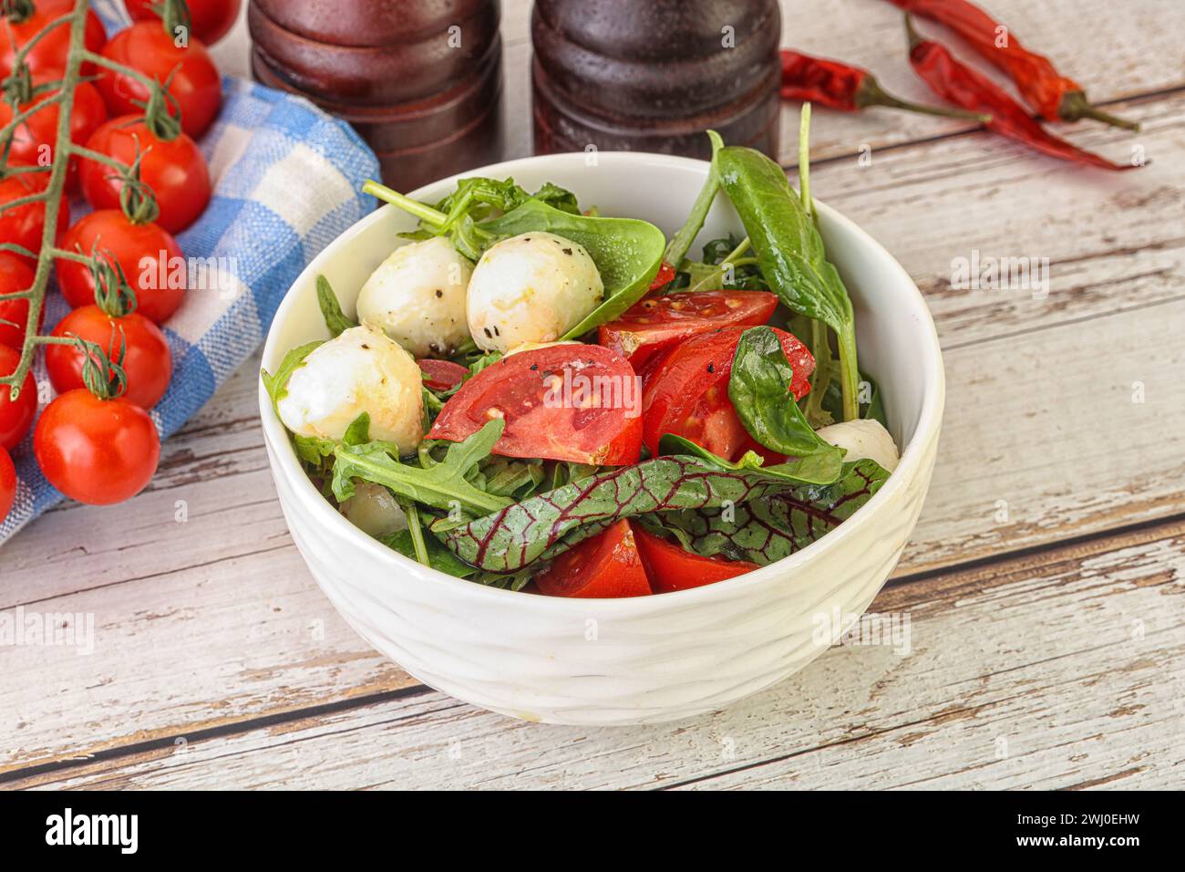 Mix salad with mini mozzarella and tomato Stock Photo - Alamy