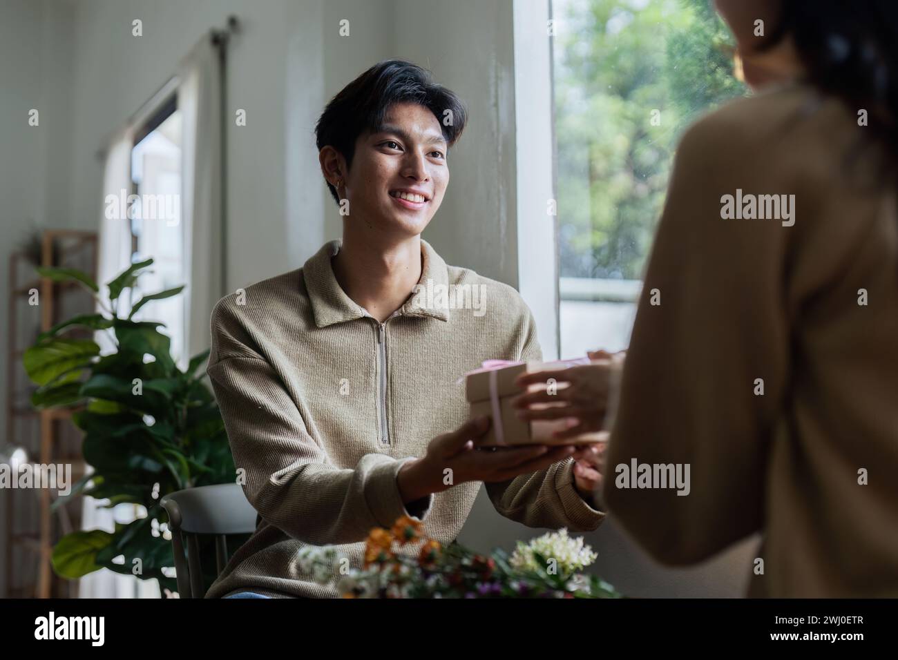 Young couple Hug and giving present on Valentine's Day. Romantic day ...