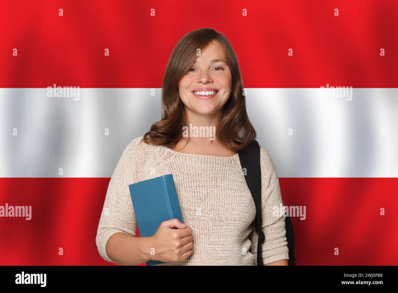Successful woman student against Austrian flag background. Travel ...