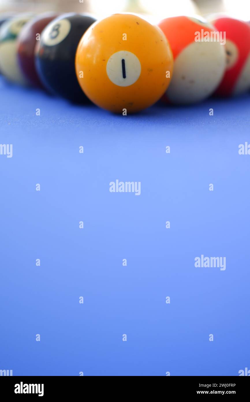 Billard balls and billard cue close up on blue billard table outdoors ...