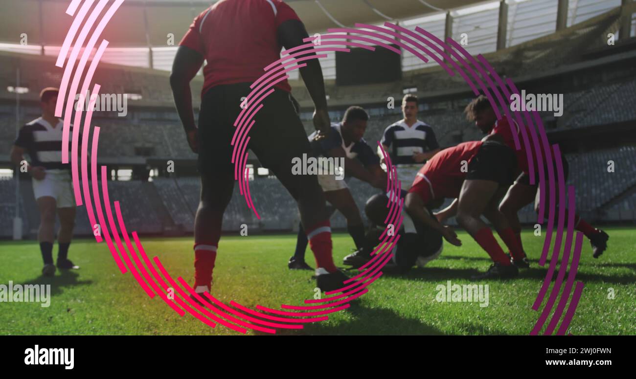 Image of red line spiral rotating over male rugby players during match ...