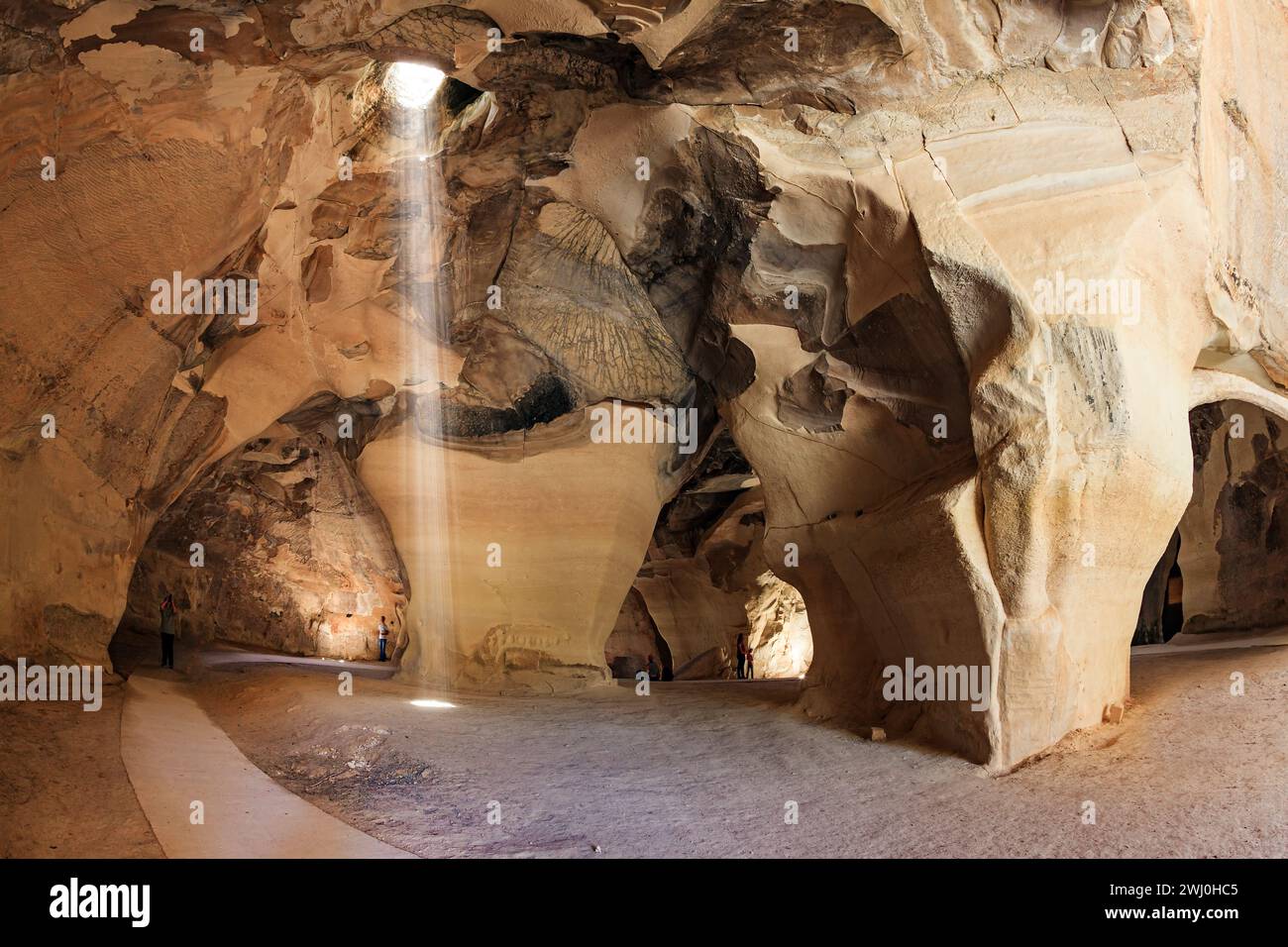 Sunbeam in the ceiling illuminates the vaults of the cave. Bell Caves ...