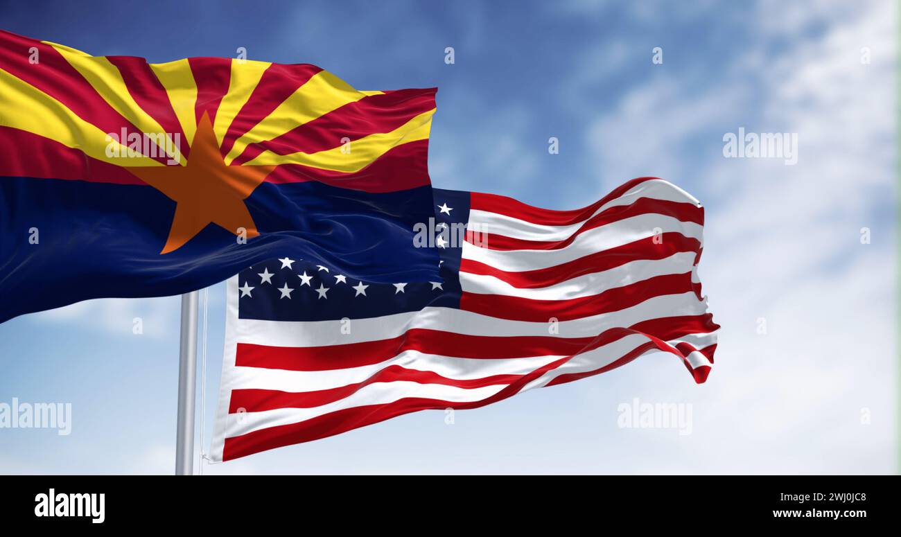 Flags of Arizona and United States waving in the wind on a clear day ...
