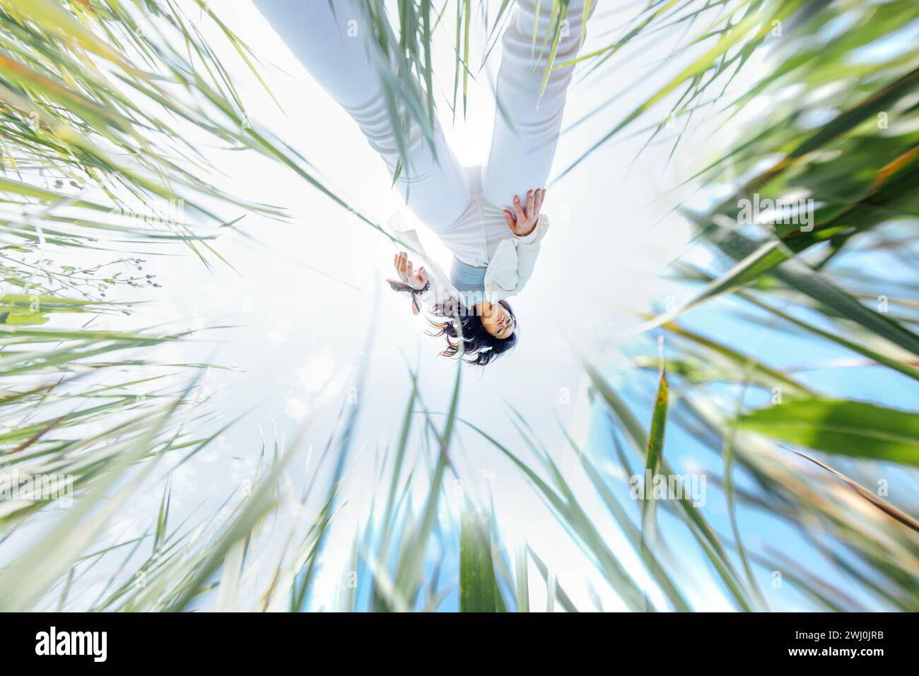 Asian woman jumping in hi-res stock photography and images - Alamy