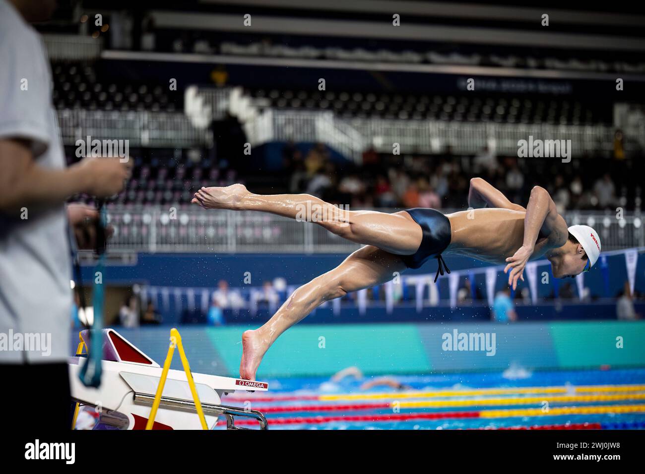 Doha, Qatar. 11th Feb, 2024. A swimmer trains before the start of the ...