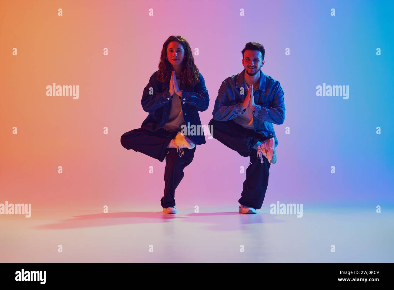 Dance duo, talented man and woman in dance poses against gradient ...