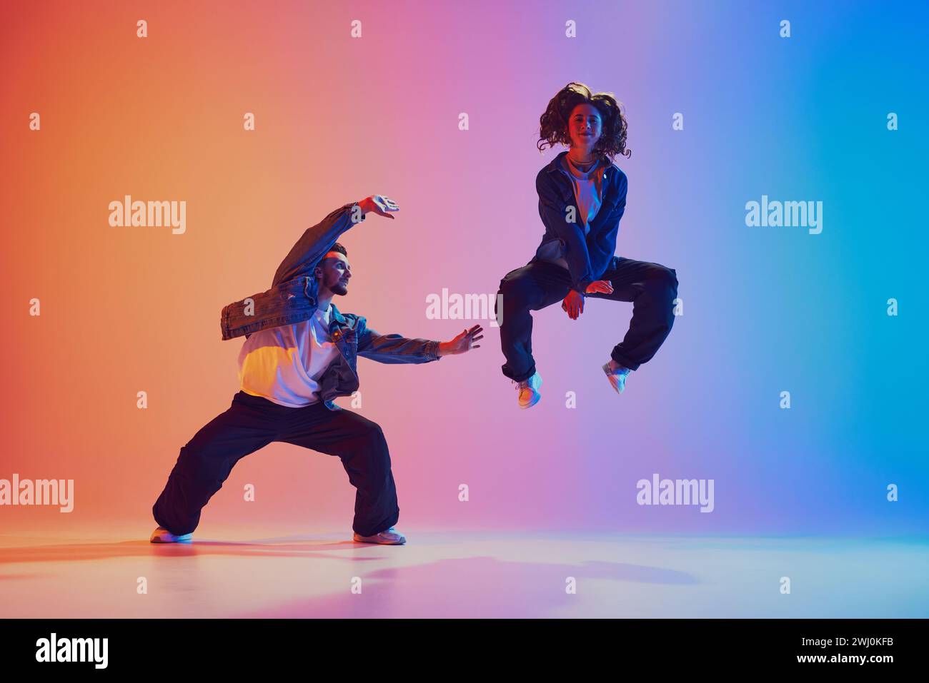 Male and female professional dancers performing creative sequence of ...