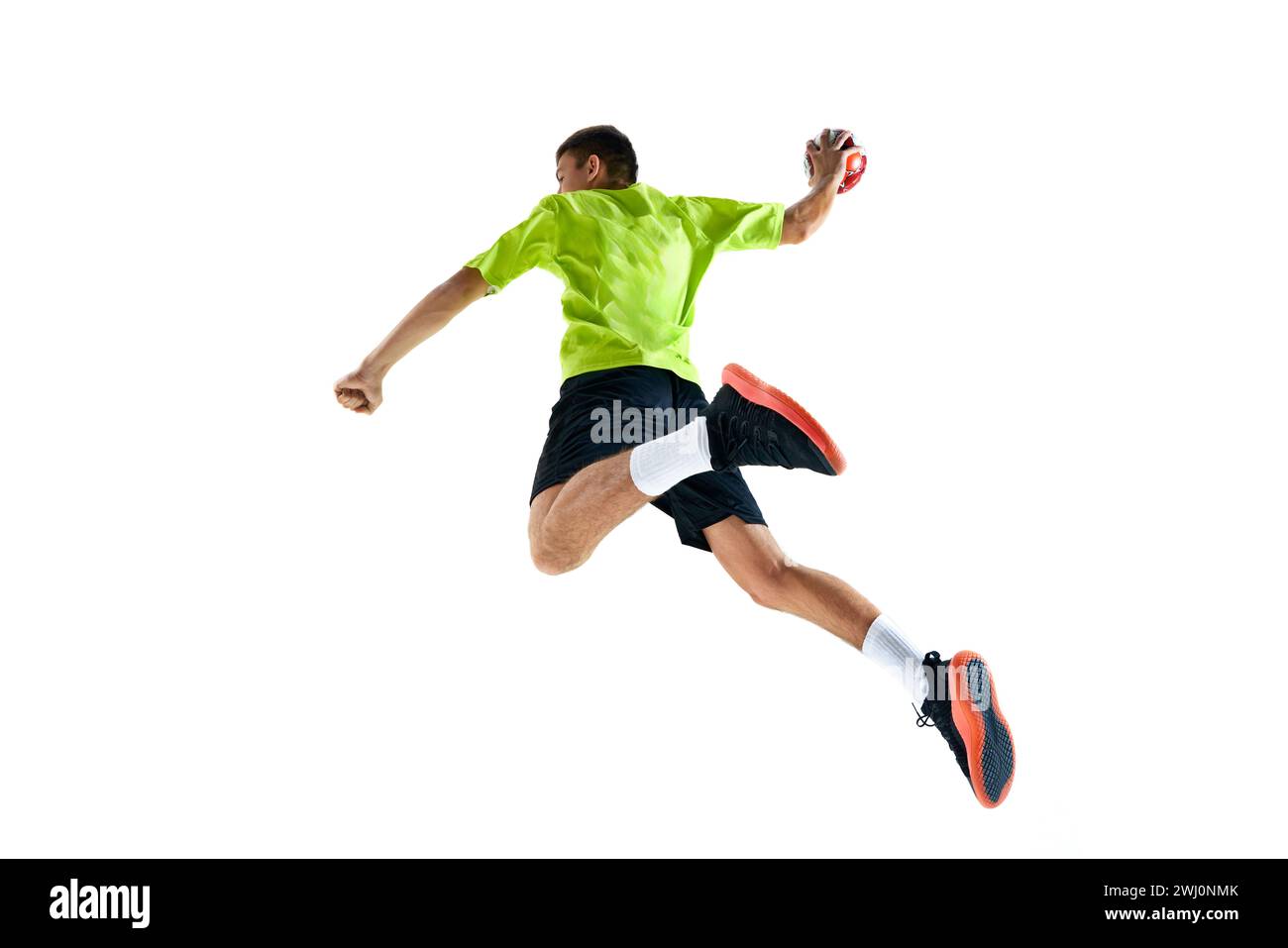 Competitive and concentrated young guy, handball player in motion ...