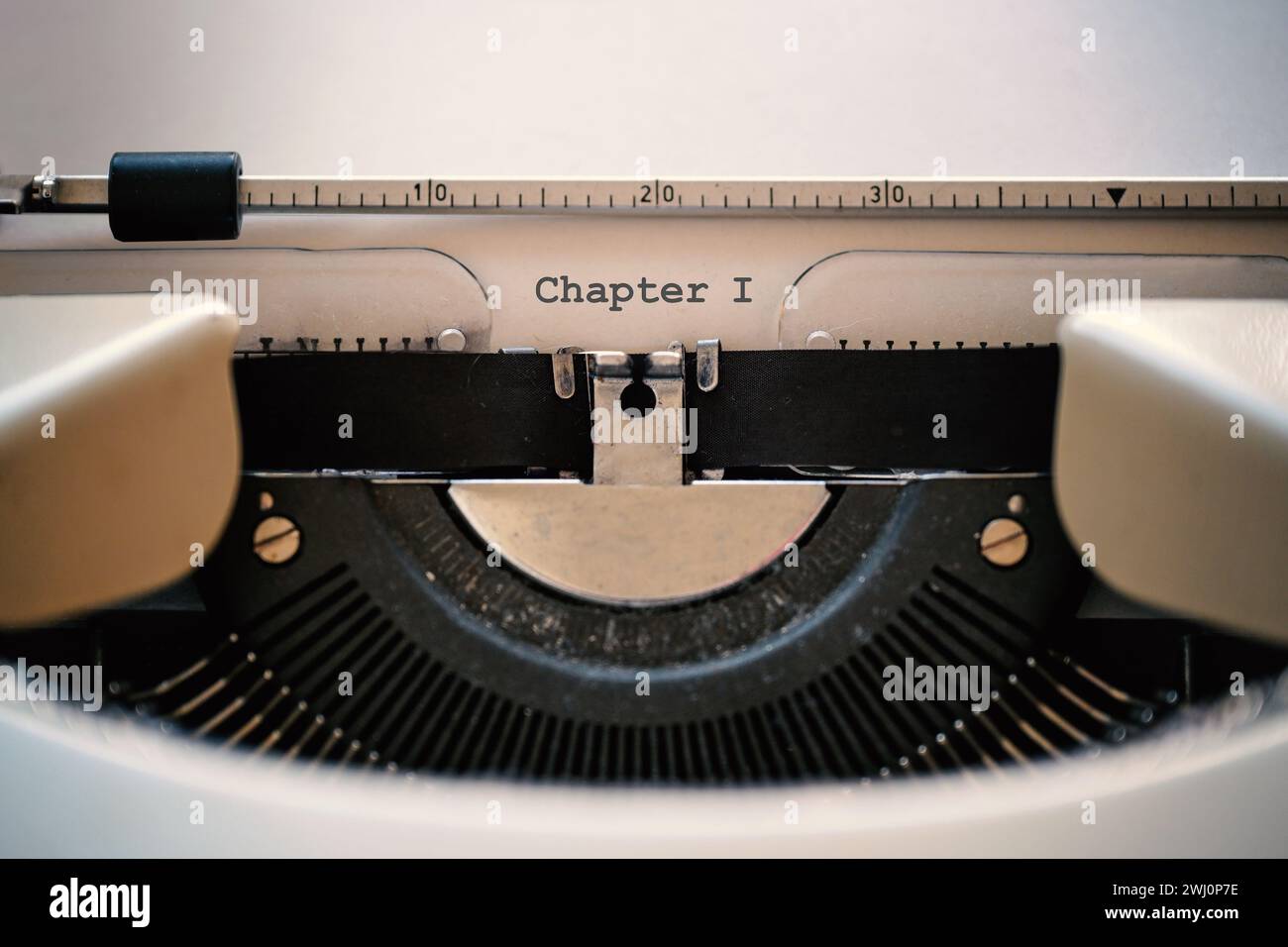 Vintage typewriter with a paper sheet, typed word chapter 1, concept ...