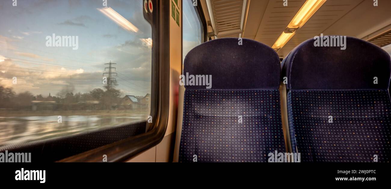 Empty passenger seats in Dutch railway train compartment with big ...