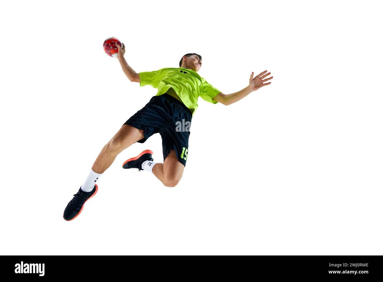 Bottom view image of young guy, handball athlete in motion during game ...