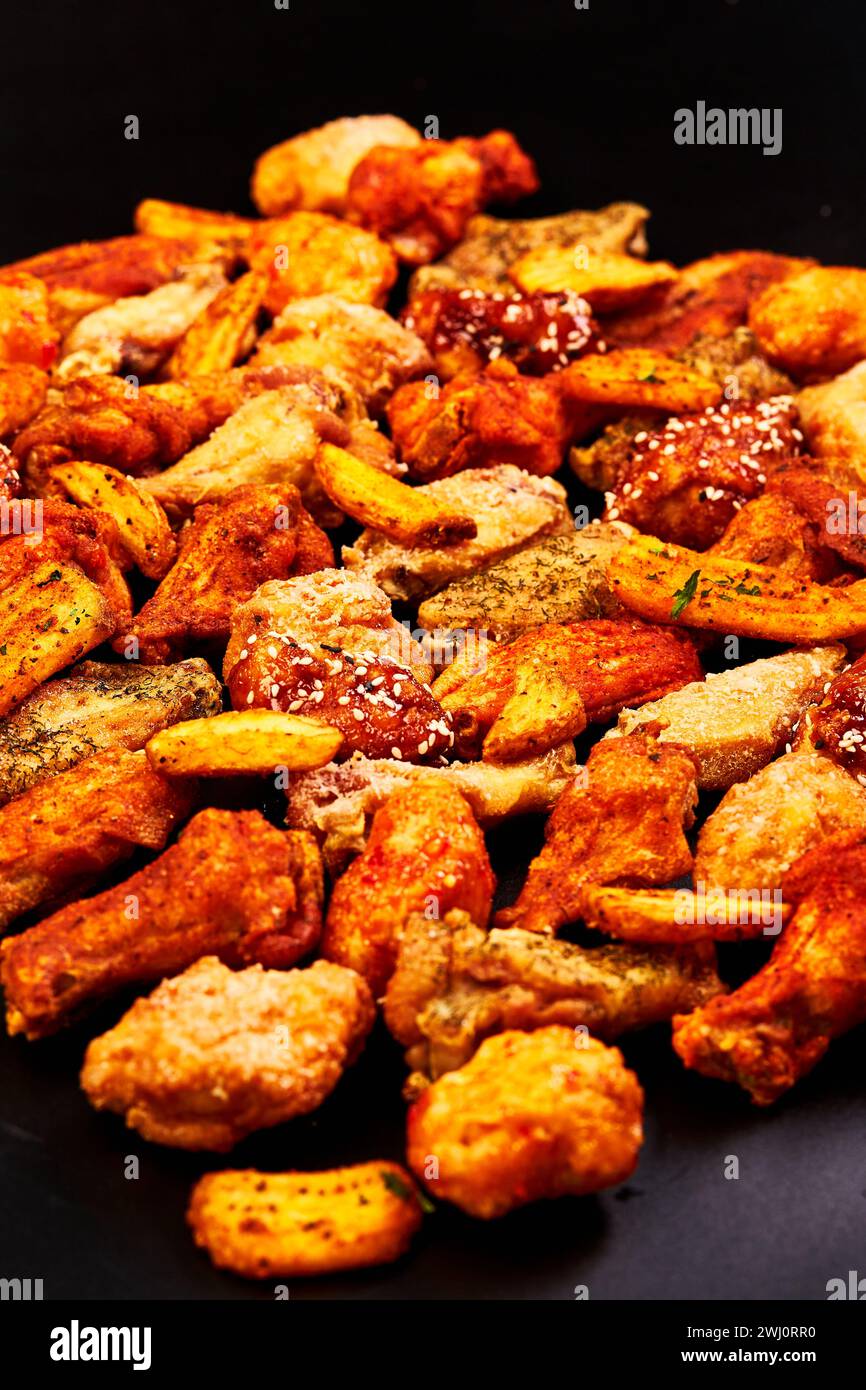 Deep fried Crispy chicken wings with different flavors and sauces on ...