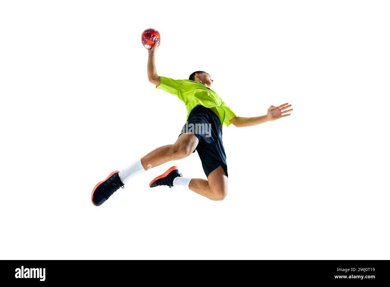 Bottom view image of young guy, handball athlete in motion during game ...