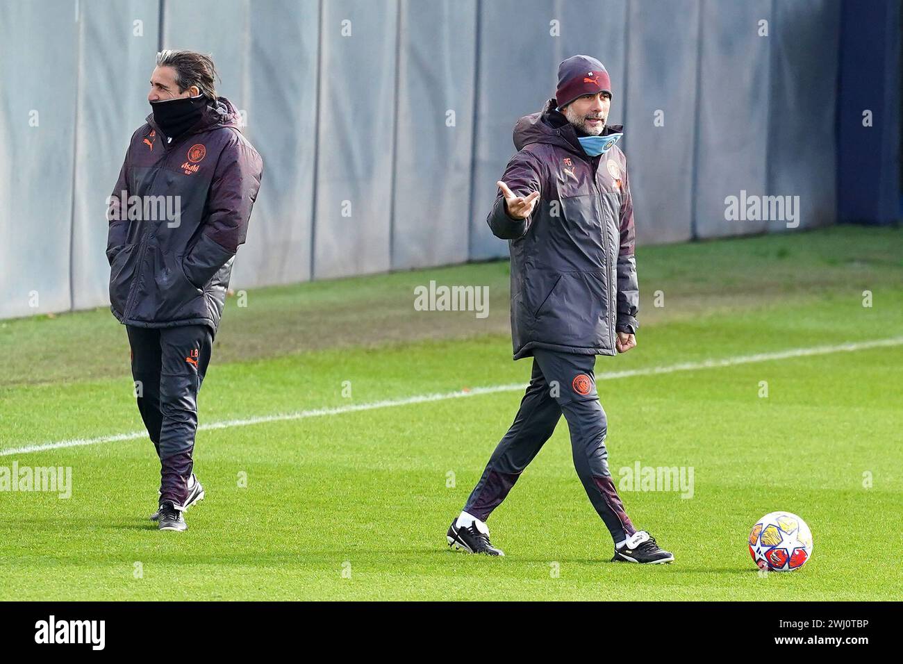 Manchester City manager Pep Guardiola (right) during a training session ...