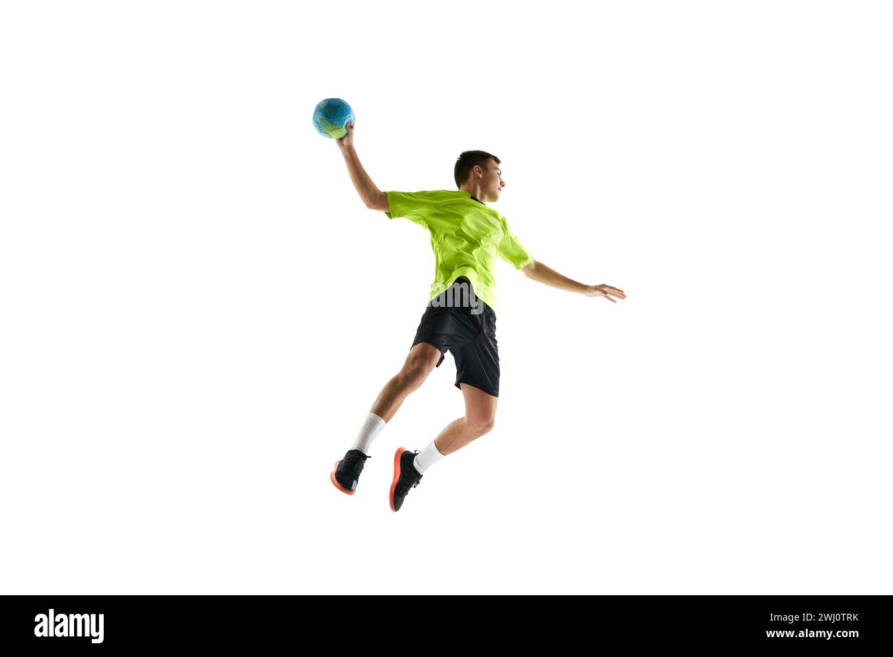 Concentrated and motivated young man, handball player in motion during ...