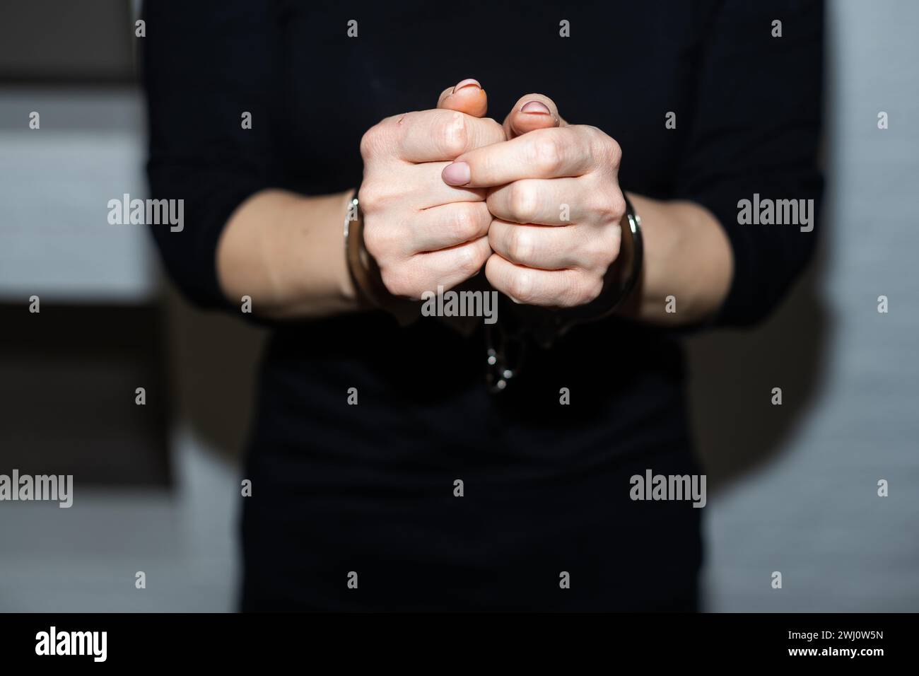 prisoner woman, prisoner's hands are handcuffed behind her back Stock ...