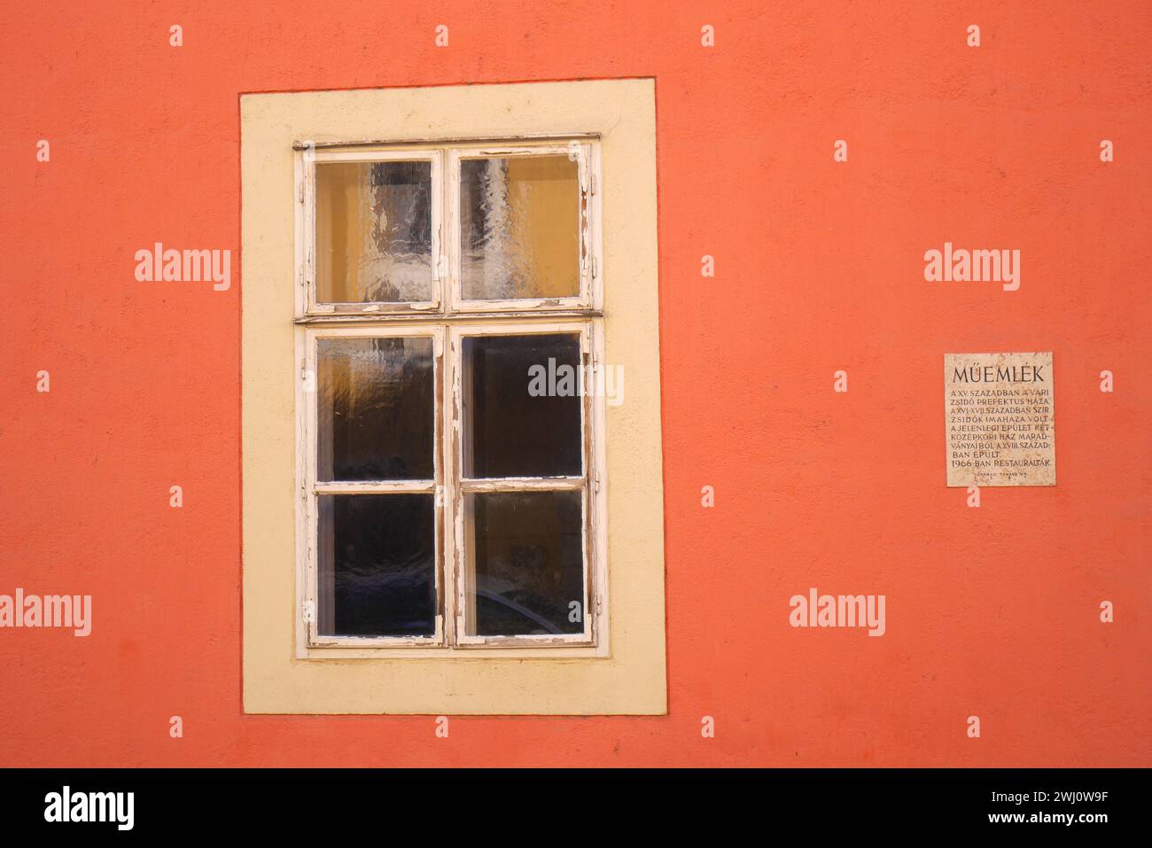 Window and listed building plaque on a house in a street in the Var ...