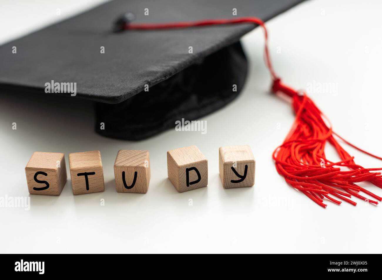 Graduation gap hat and wooden cubes, Education study testing learning ...