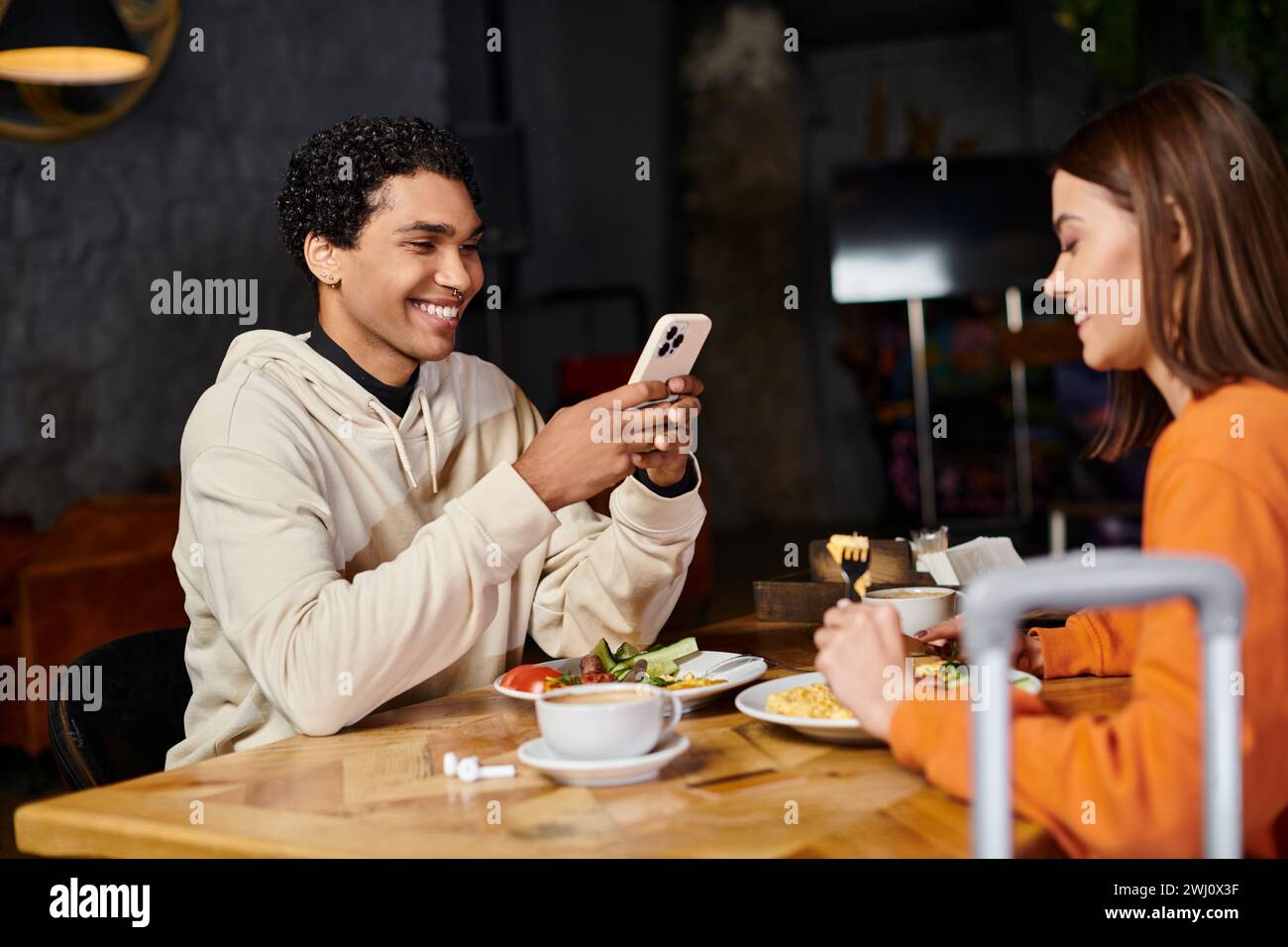 Couple sitting across breakfast table hi-res stock photography and ...