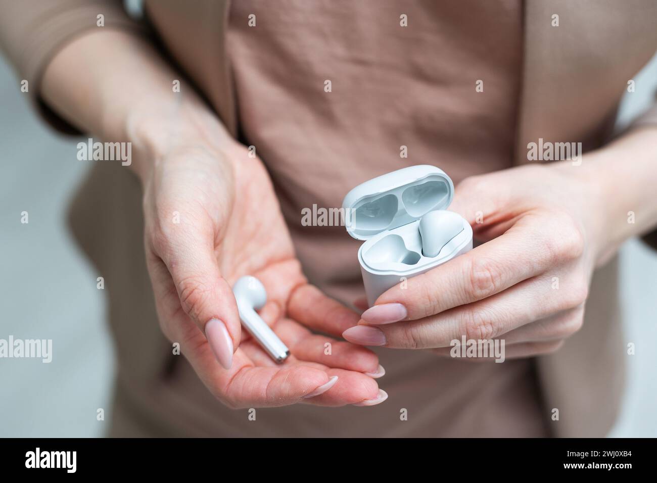 White wireless earphones in-ear or earbud bluetooth with charging case ...