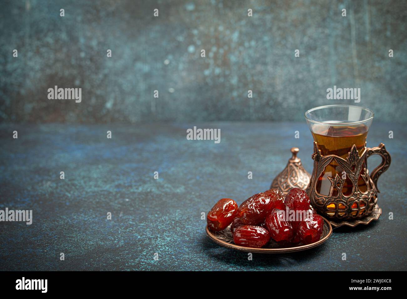 Breaking fasting with dried dates during Ramadan Kareem, Iftar meal ...