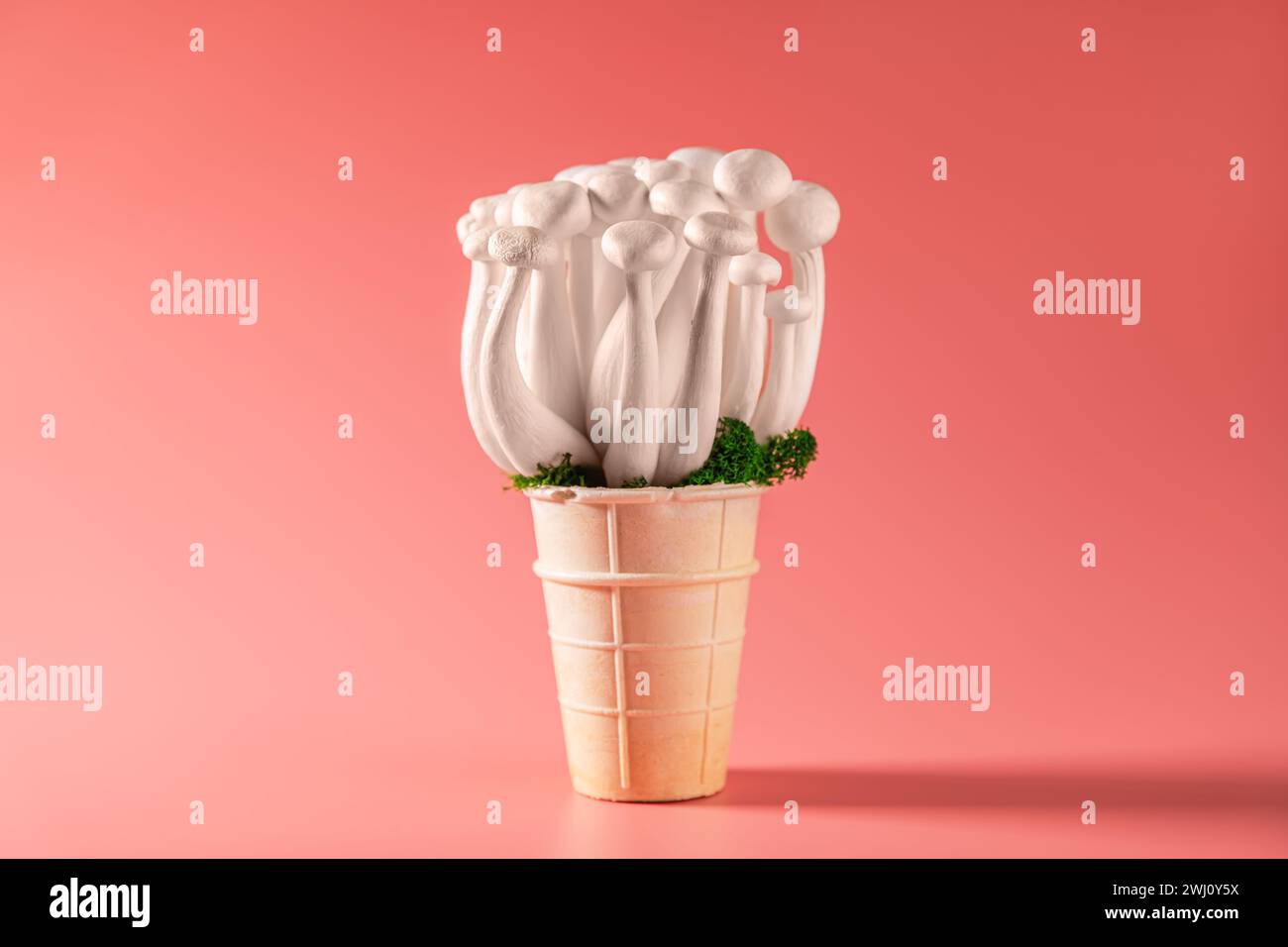Closeup of a bunch of shimeji mushrooms with green moss in green ice ...