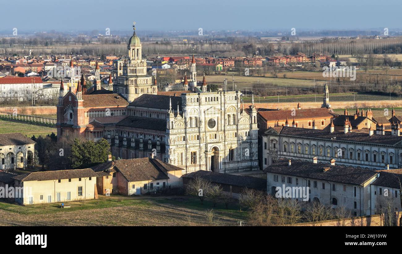 Aerial shot over Certosa di Pavia monastery with lawn fields in Italy ...