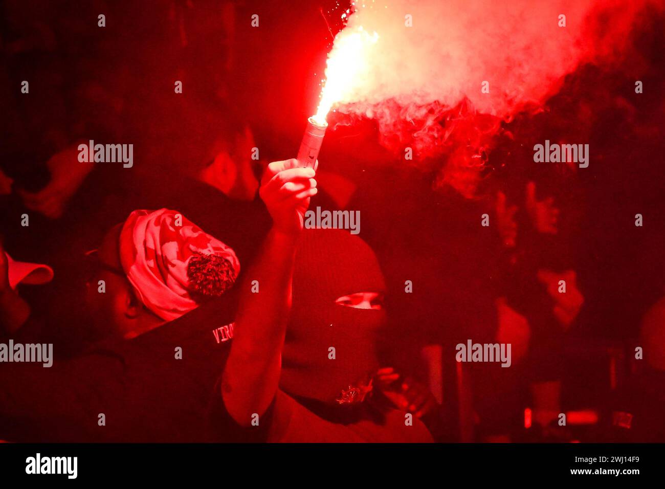 A PSG supporter uses a smoke bomb during the French championship Ligue ...
