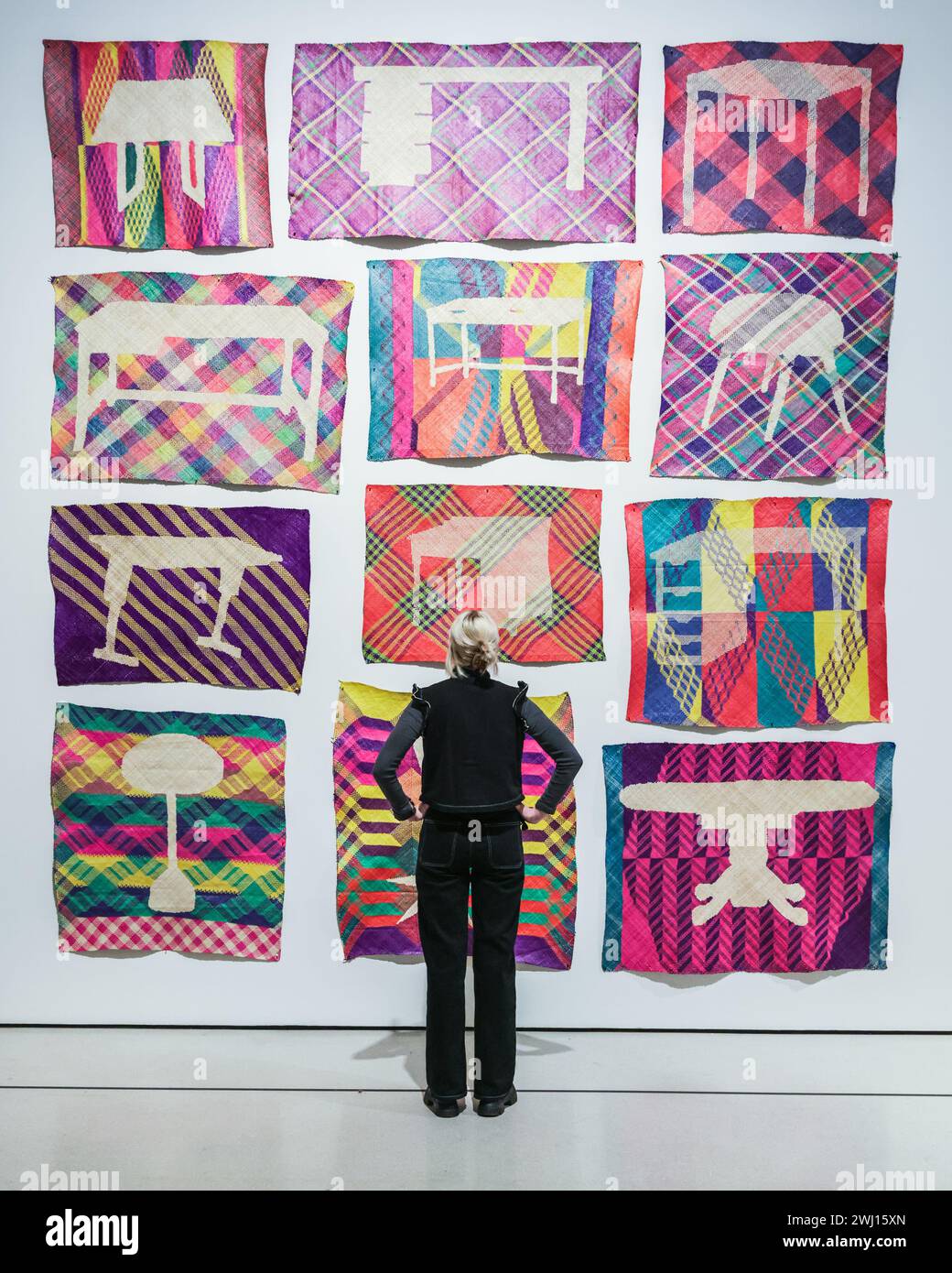 Barbican Art Gallery, London, UK. 12th Feb, 2024. Staff with Yee I-Lann weaving work Tikar/Maja ...