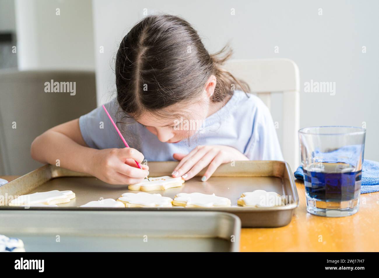 Little Girl Spells 'Sorry' on Iced Sugar Cookies Stock Photo - Alamy