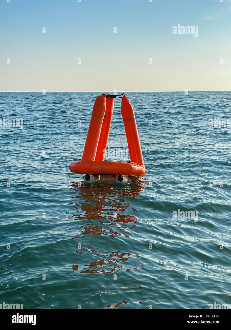 Inflatable orange buoys in a lake. Safety in a water Stock Photo - Alamy