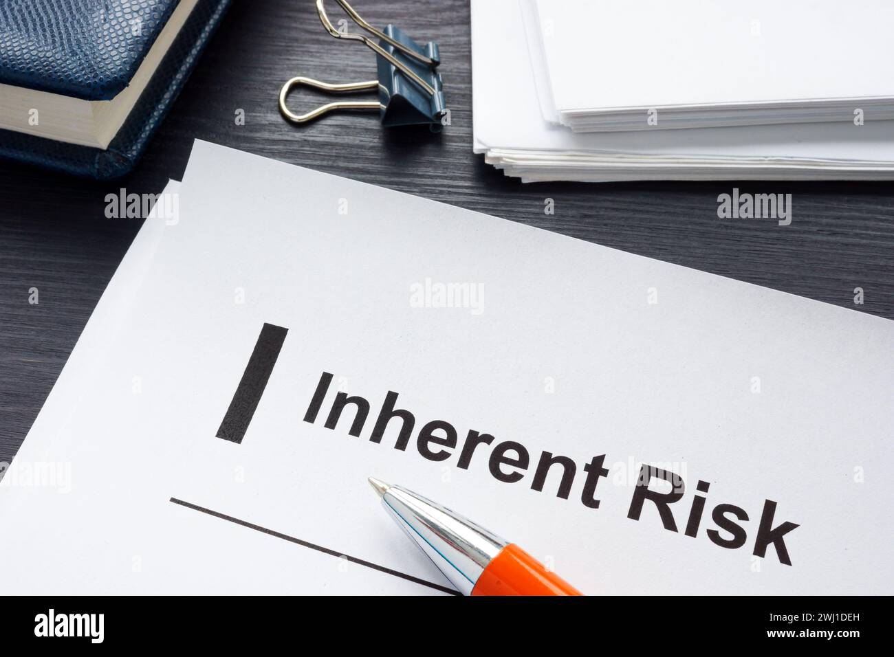Documents about inherent risk and stack of papers Stock Photo - Alamy