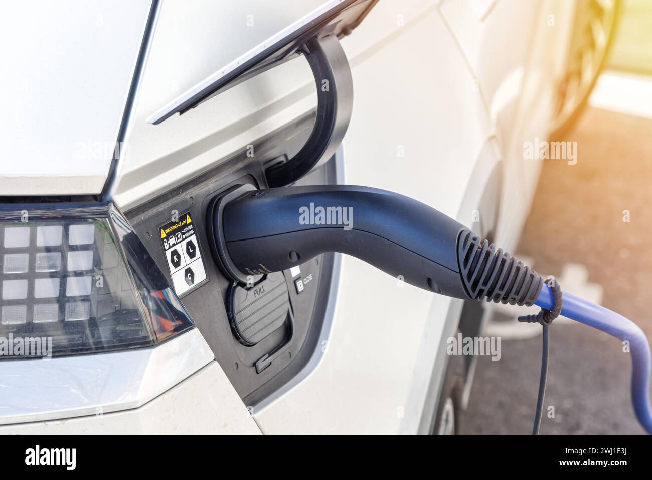 Charging the battery of an electric car with electricity E-car at an ...