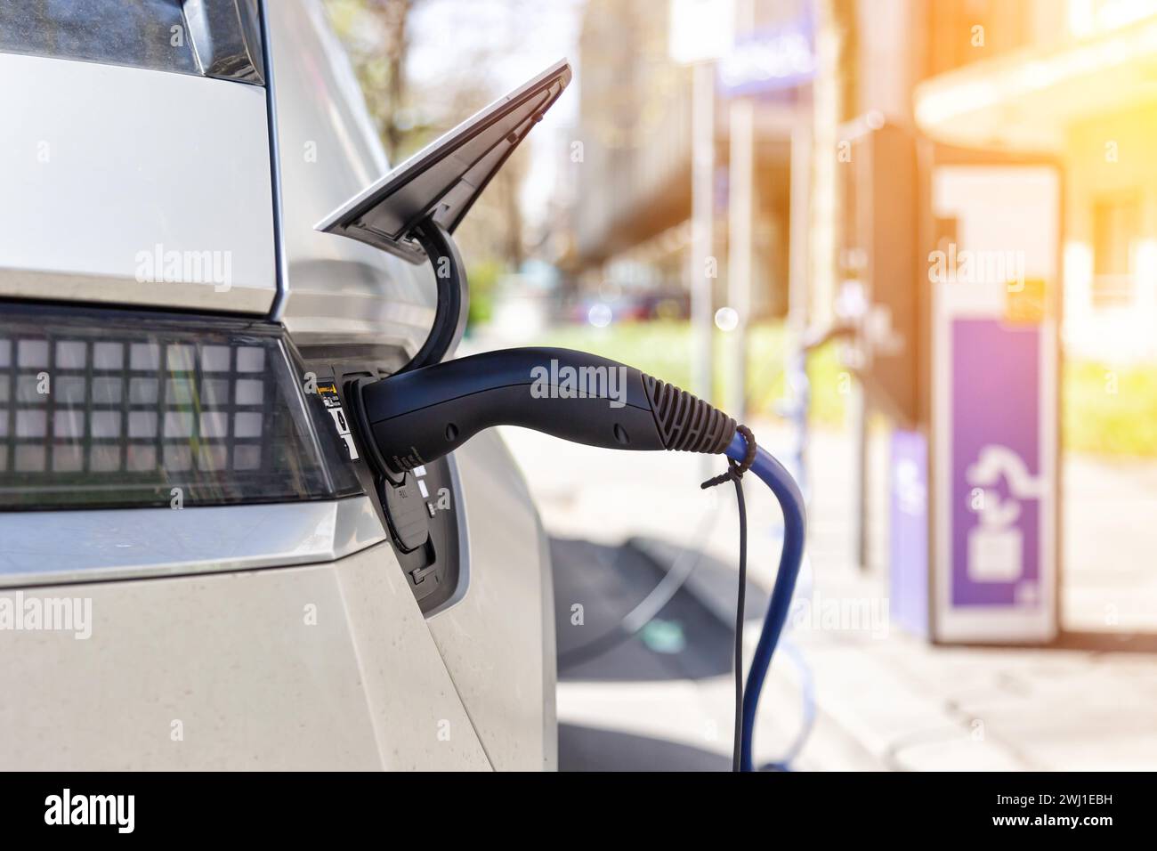 Charging the battery of an electric car with electricity E-car at an ...