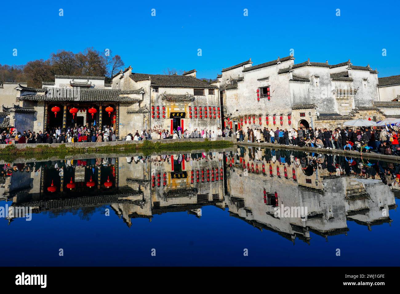 HUANGSHAN, CHINA - FEBRUARY 12, 2024 - Tourists visit Hongcun village ...