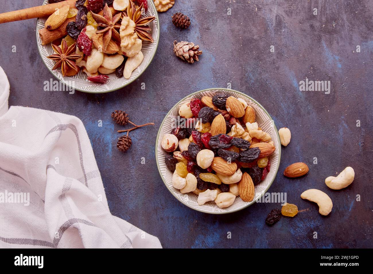 Aesthetic saucers with mixed nuts close up. Walnuts, almonds, hazelnuts ...