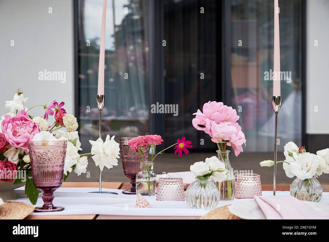 Outside aesthetic festive table setting, flowers arrangement Stock ...