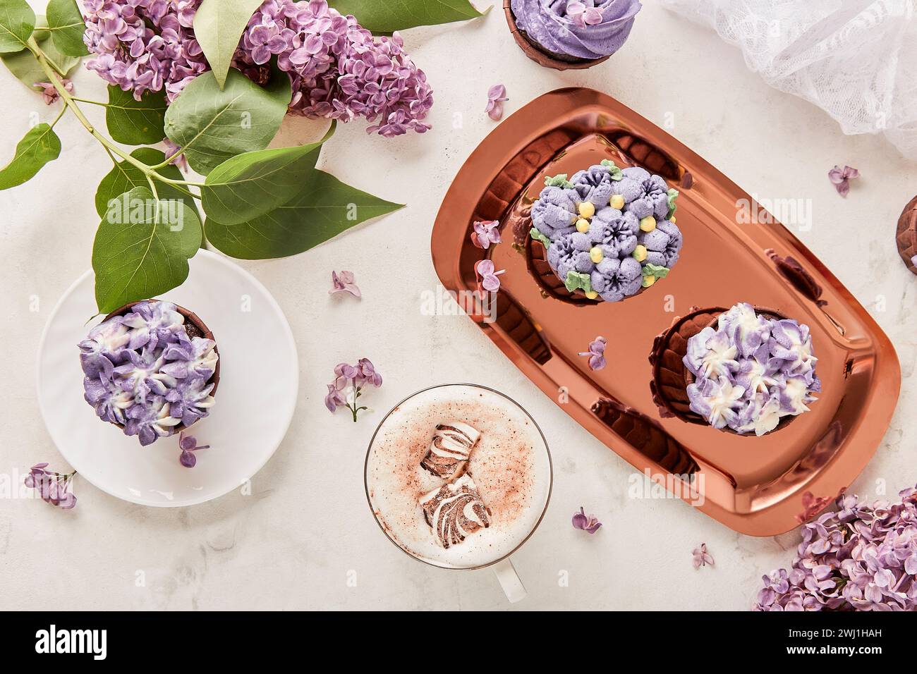 Floral purple cupcakes on the golden tray using trend Dreamy Escapism ...