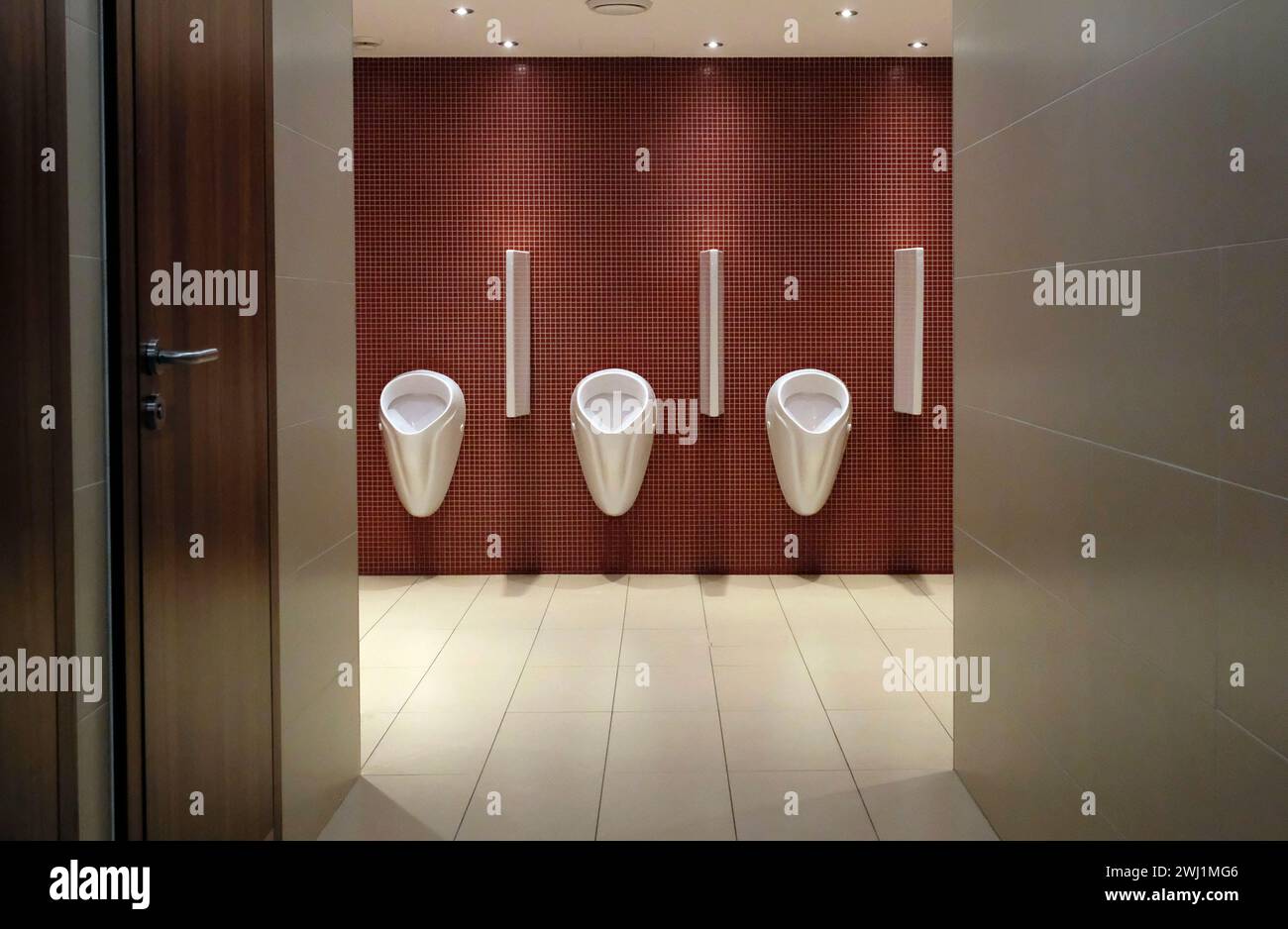 Urinals in a men's restroom Stock Photo - Alamy