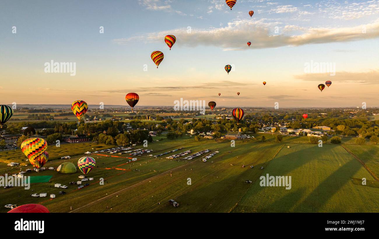 Aerial View of Multiple Hot Air Balloons Floating Up During a Morning ...