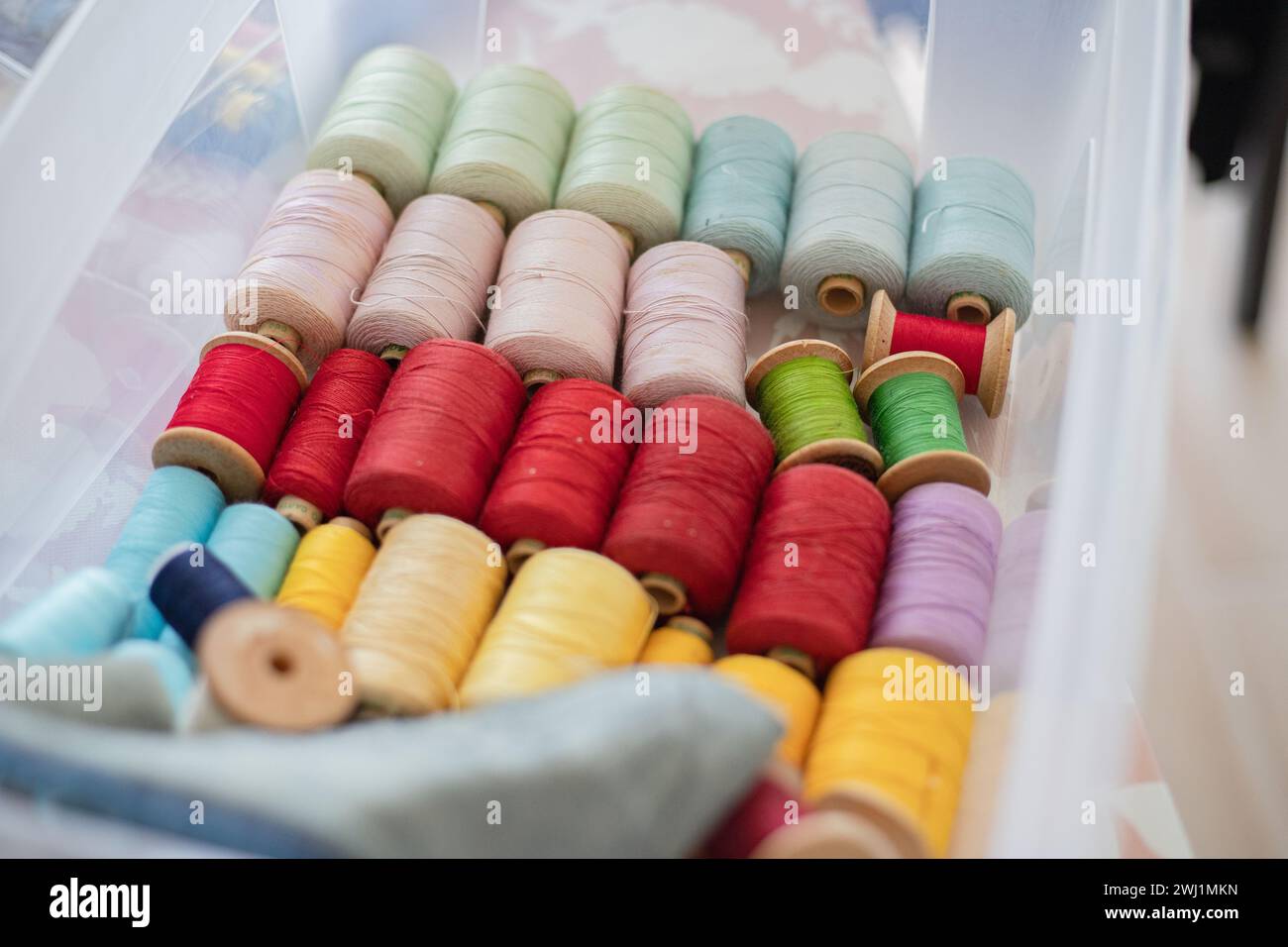 Rolls of thread, spools of thread in different colors for sewing work ...