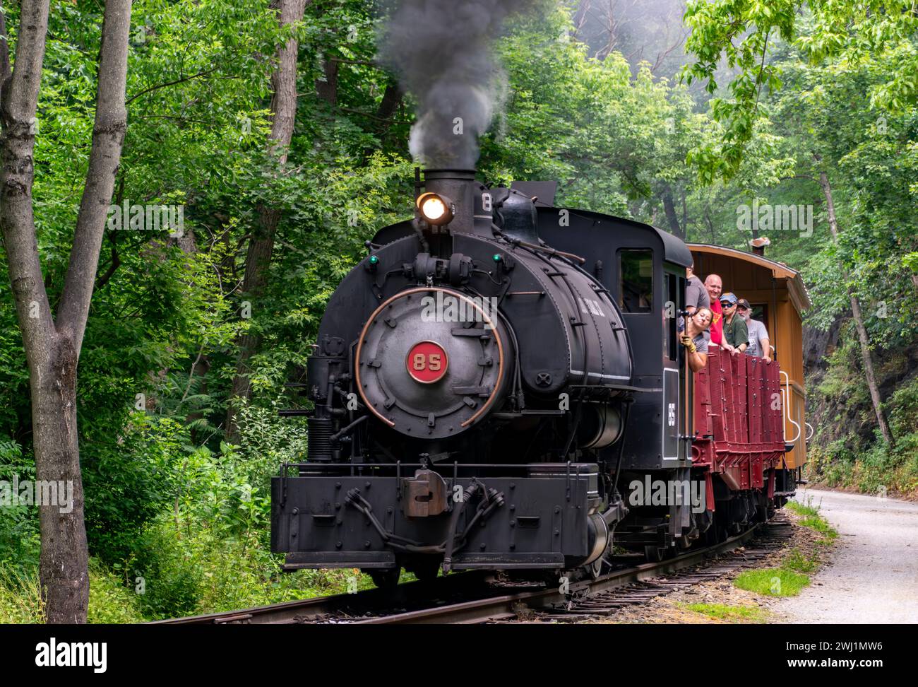 View of an approaching Steam Passenger Train Blowing Smoke as Passenger ...