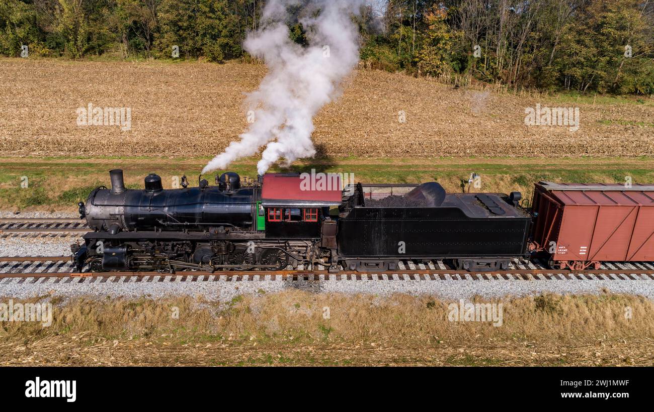 Aerial View of an Antique Steam Freight Passenger Train Blowing Smoke ...